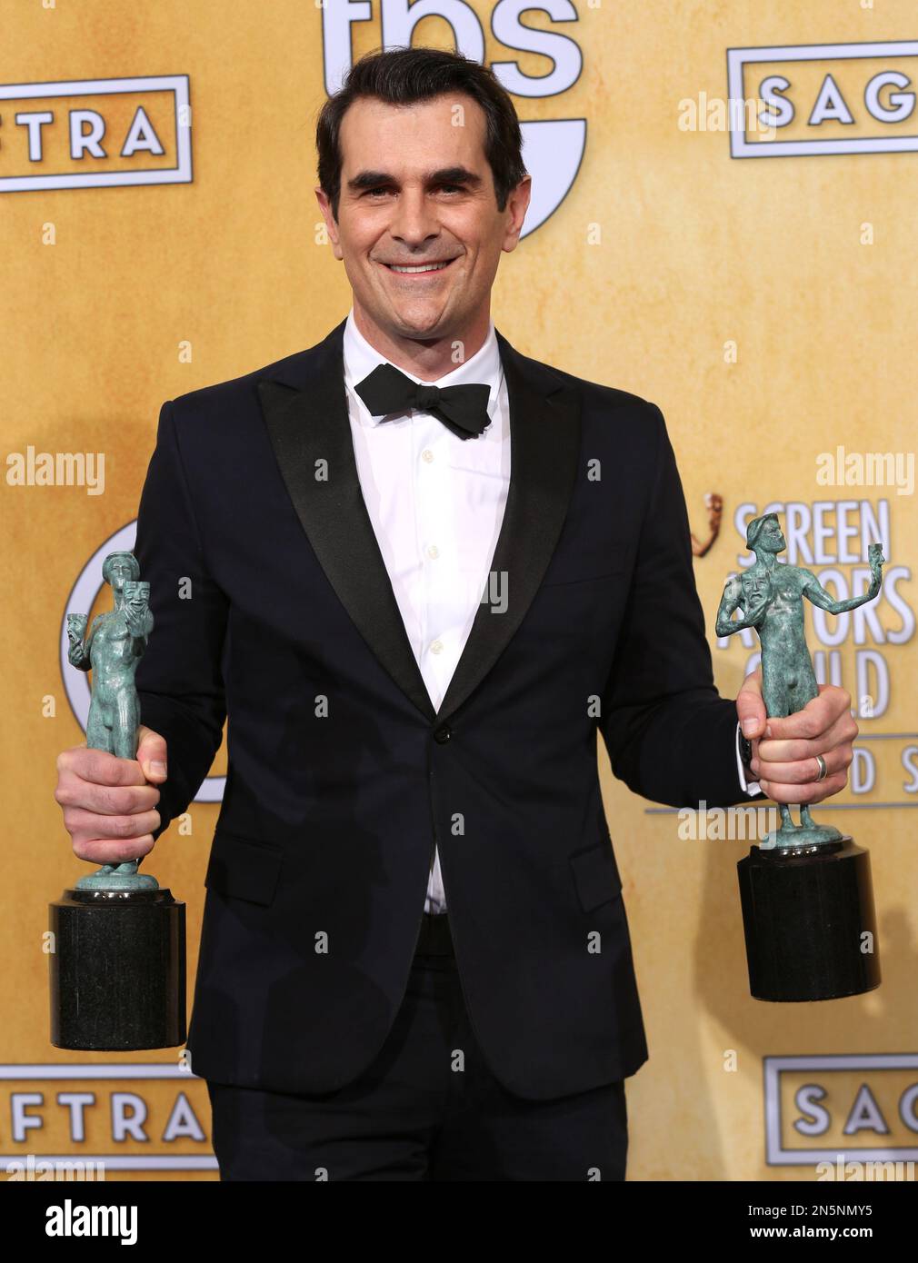 Ty Burrell poses with the award for outstanding performance by an ...