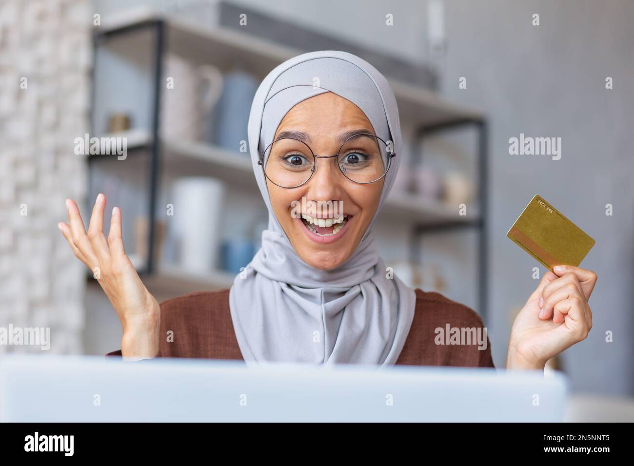 Happy female shopper in online store celebrating victory and successful ...