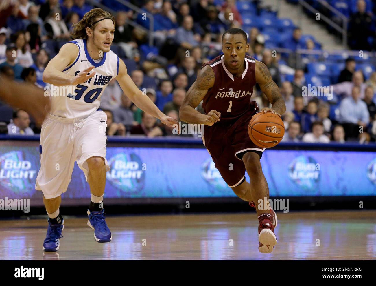 Fordham's Mandell Thomas, right, heads to the basket past Saint Louis ...