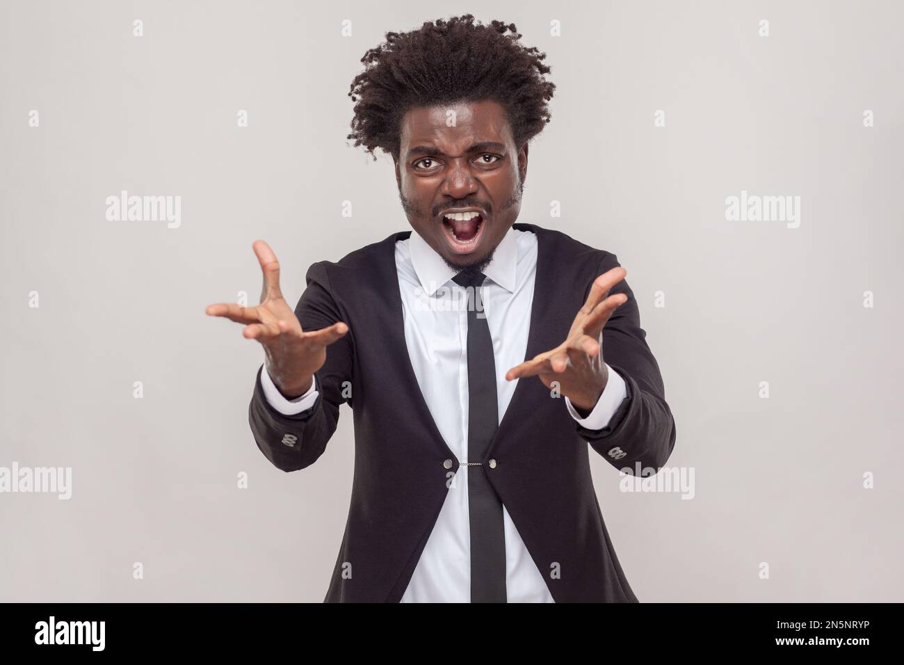 Emotional man yelling loudly, opens mouth broadly, feels desperate ...