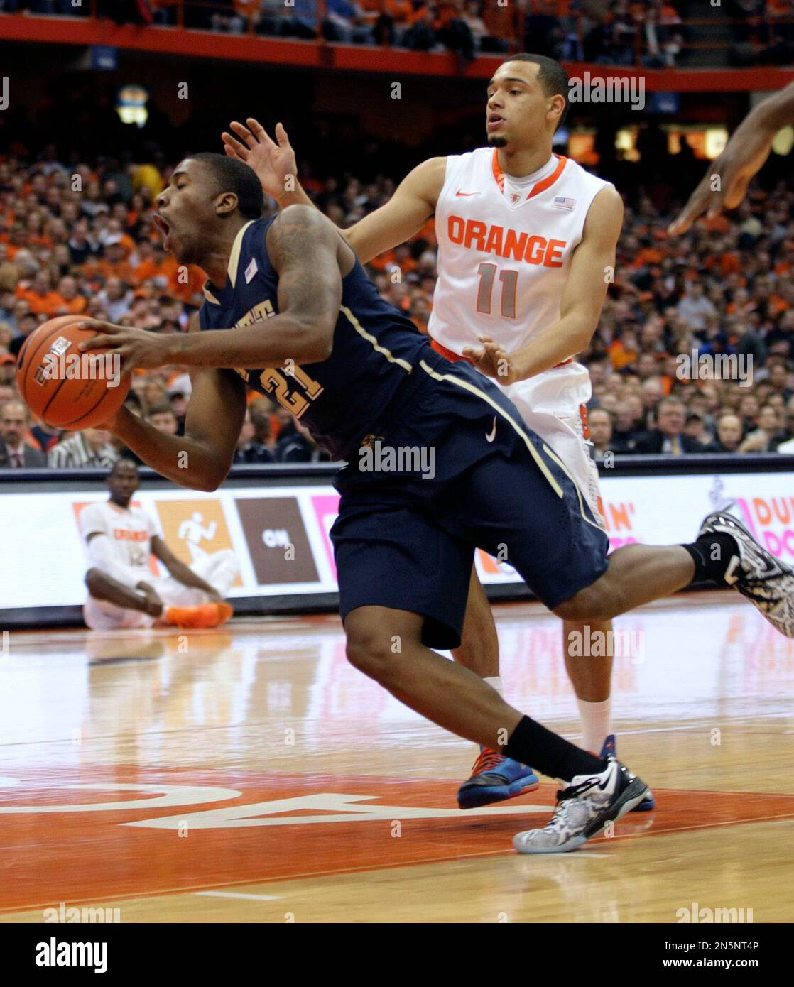 Pittsburgh’s Lamar Patterson, left, drives past Syracuse’s Tyler Ennis ...