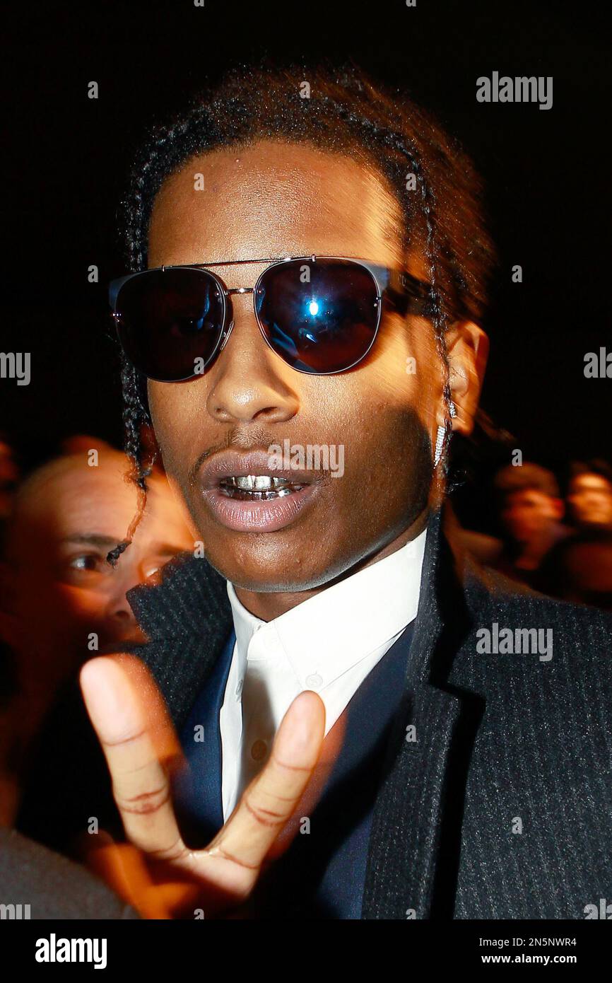 Rap singer Asap Rocky gestures with a peace sign as he arrives for Dior ...