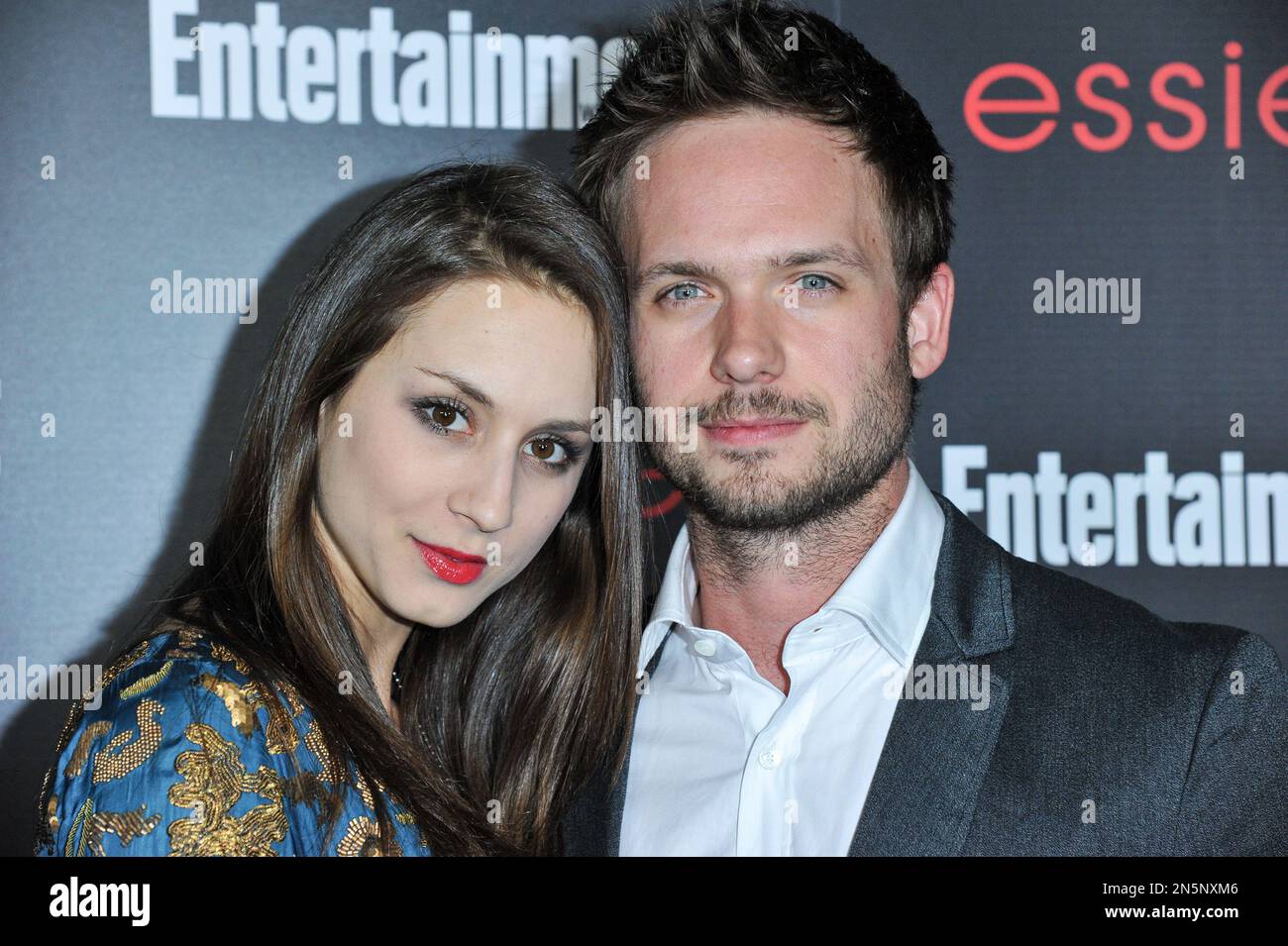 Troian Bellisario, left, and Patrick J. Adams arrive at the ...
