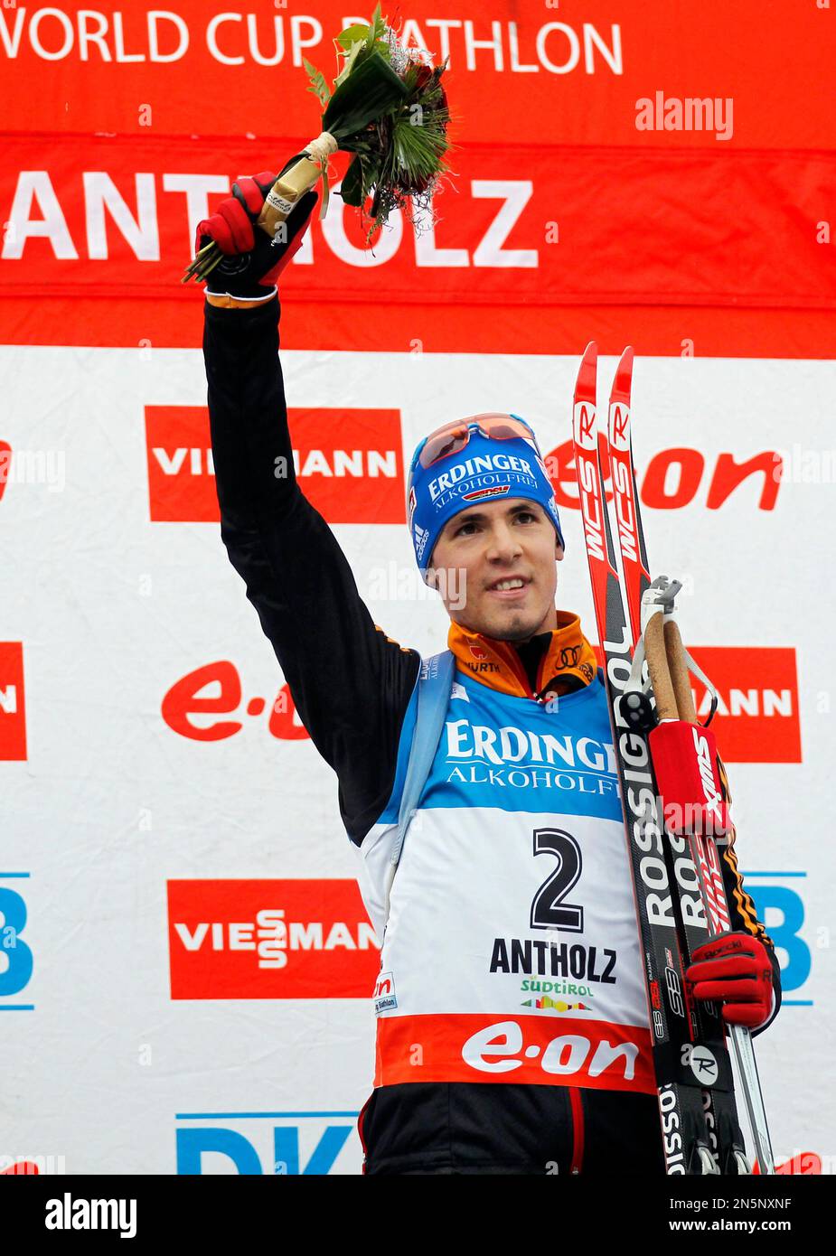 Germany's Simon Schempp celebrates on the podium after winning a men's ...