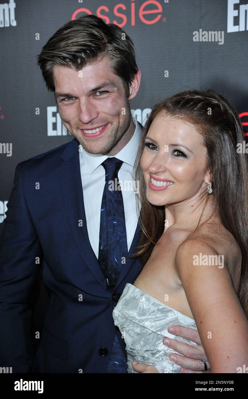 Liam McIntyre, left, and Erin Hasan arrive at the Entertainment Weekly ...