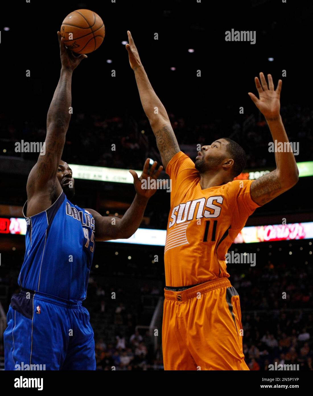 Dallas Mavericks center DeJuan Blair (45) shoots over Phoenix Suns ...