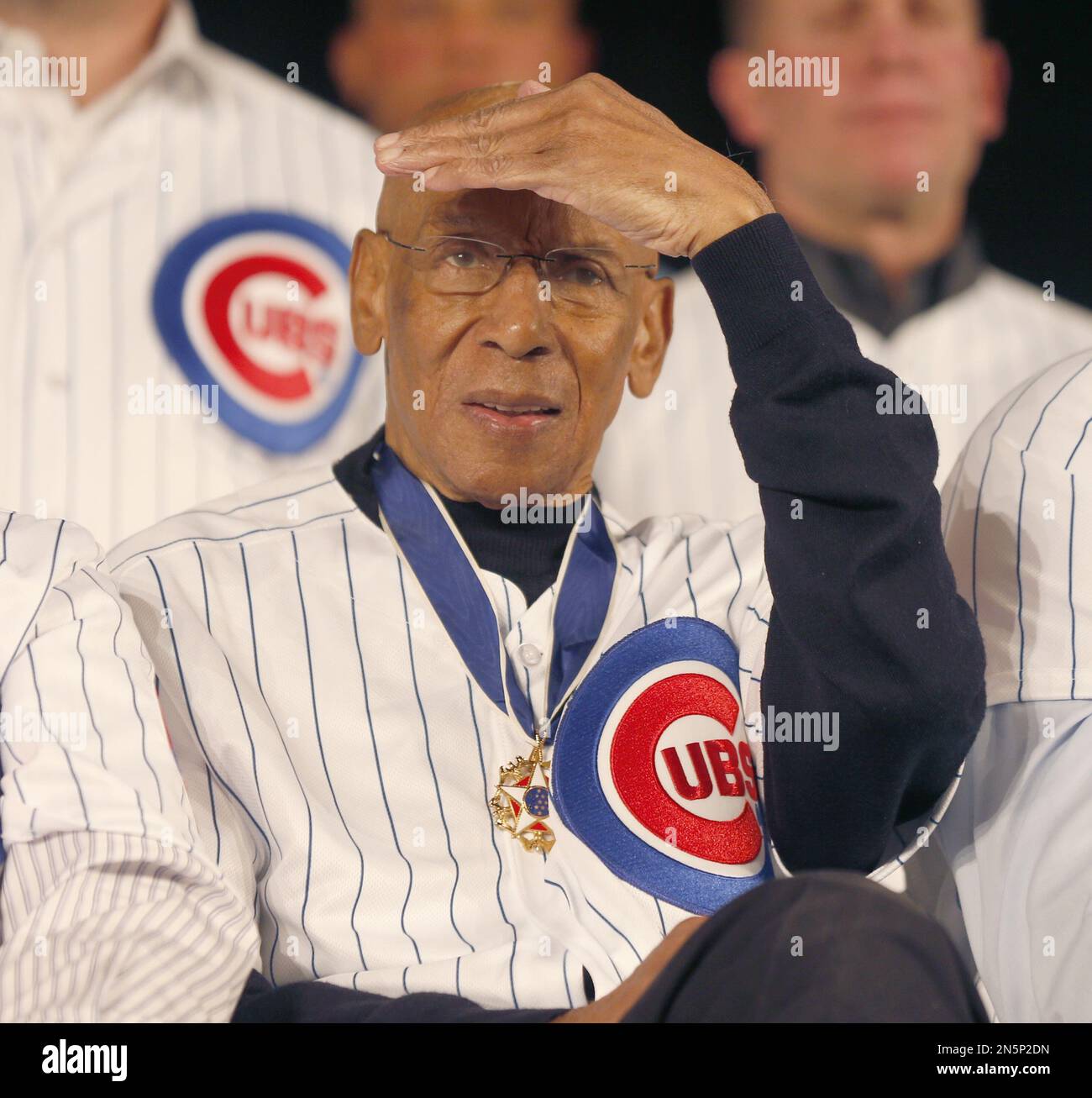 Chicago Cubs' Hall of Fame infielder, "Mr. Cub" Ernie Banks shields his ...