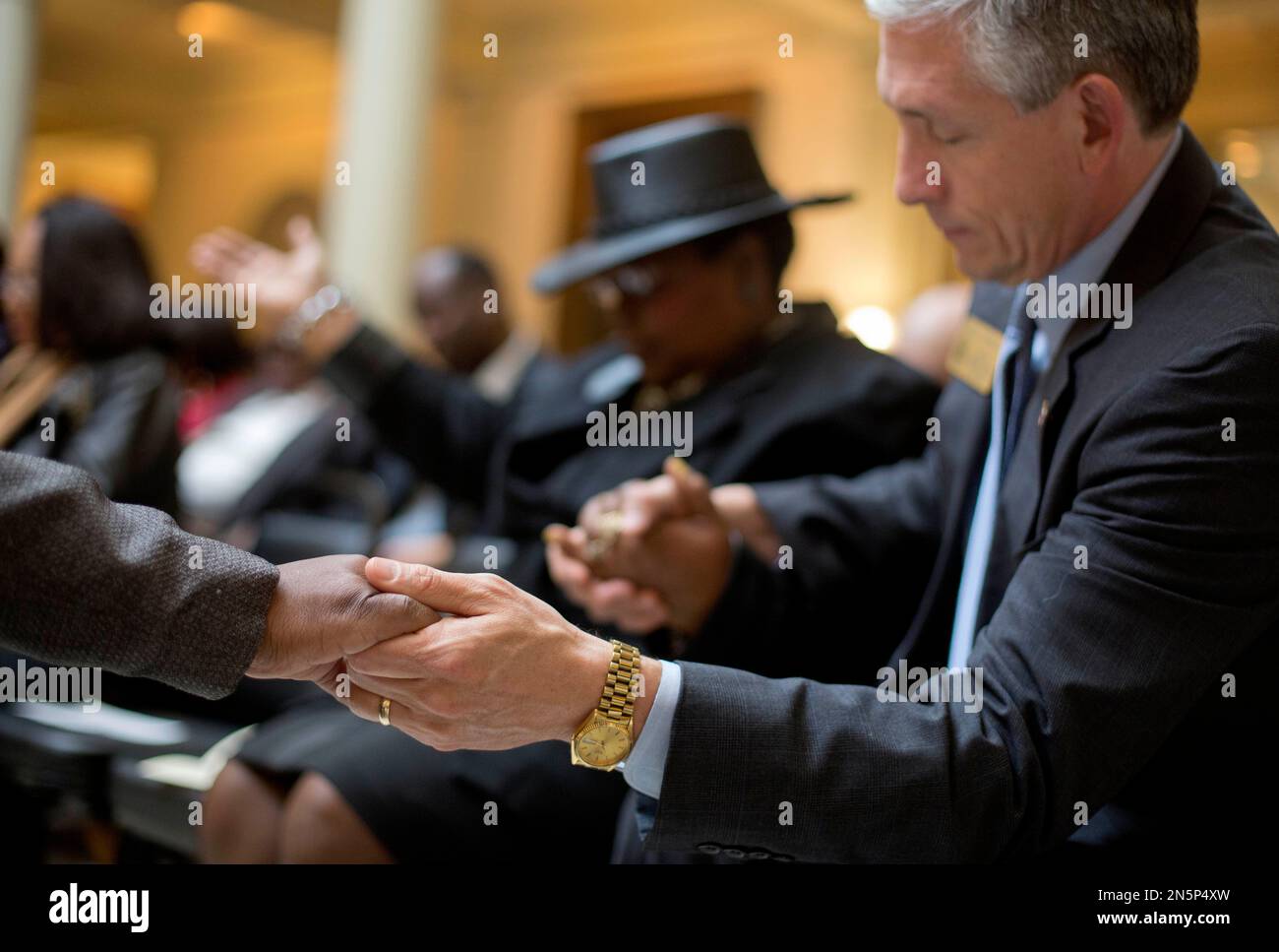 Georgia Supreme Court Justice David Nahmias, right, joins hands with ...