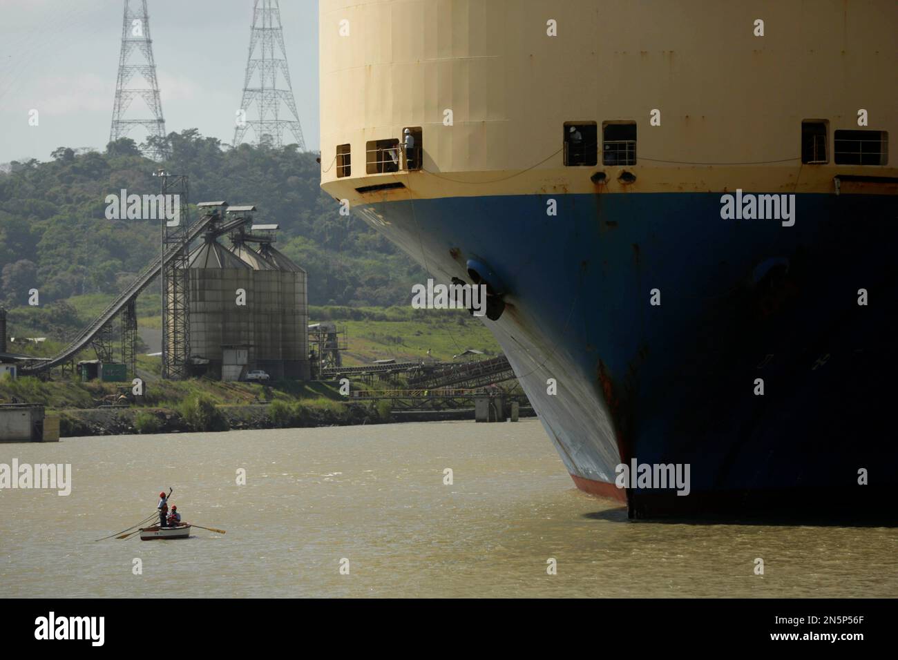 In this Jan. 14, 2014 photo, a small boat takes in a line of rope from ...