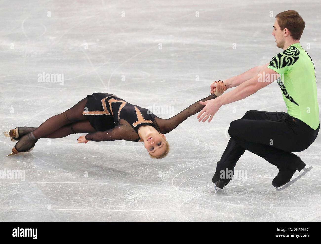 Ukraine's Julia Lavrentieva and Yuri Rudyk perform in the pairs short ...