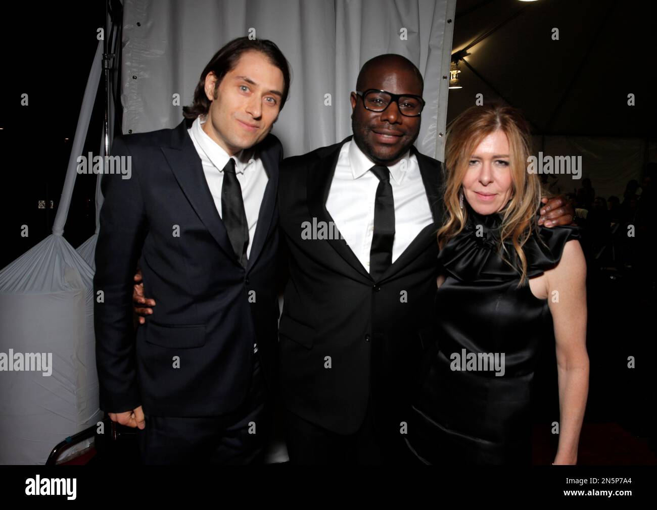 From left, Jeremy Kleiner, Steve McQueen and Dede Gardner pose in the ...
