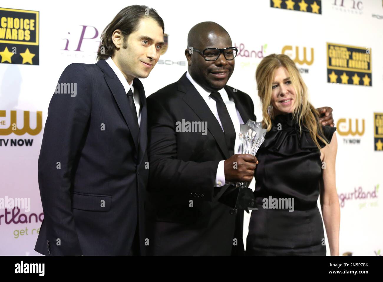 From left, Jeremy Kleiner, Steve McQueen and Dede Gardner pose in the ...