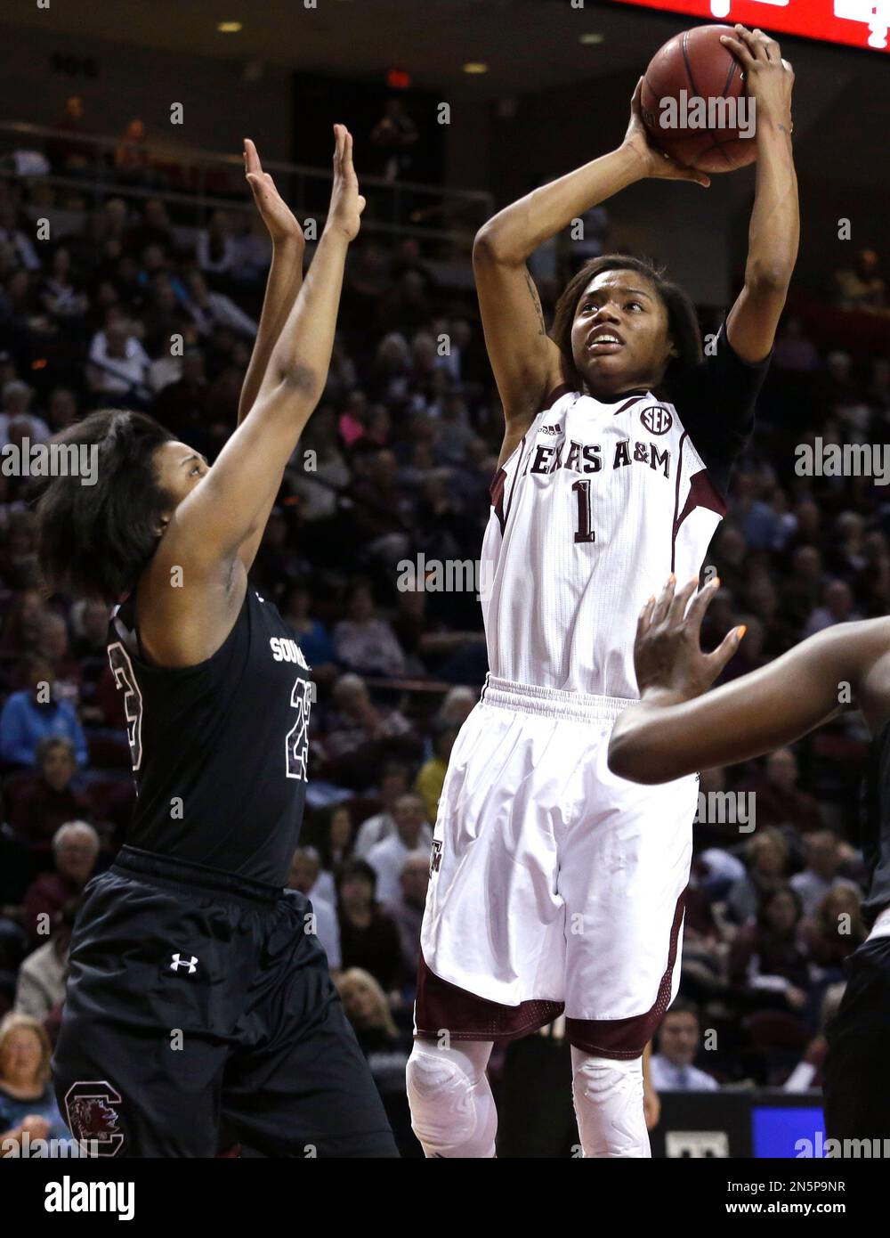 Texas A&M's Courtney Williams (1) shoots over South Carolina's Tina Roy ...