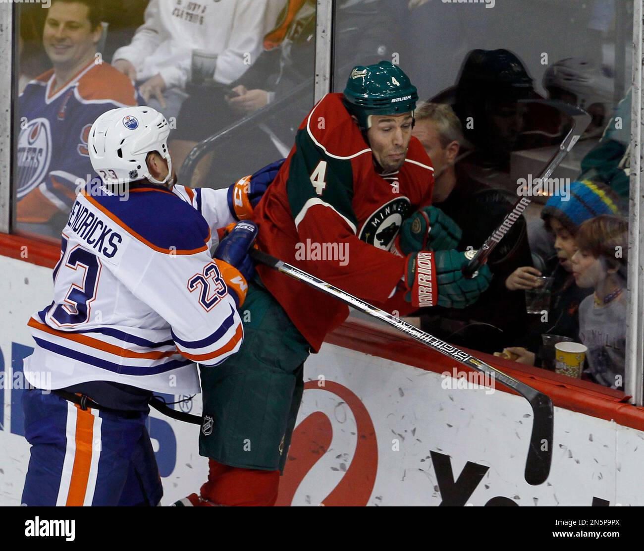 Edmonton Oilers center Matt Hendricks (23) slams Minnesota Wild ...