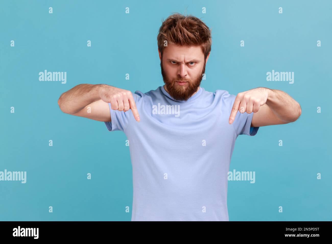 Here and right now. Portrait of bearded man standing and looking at ...