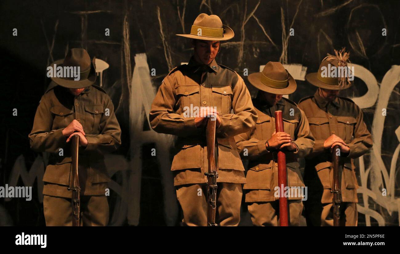 Aboriginal performers rest on their arms during a dress rehearsal of ...