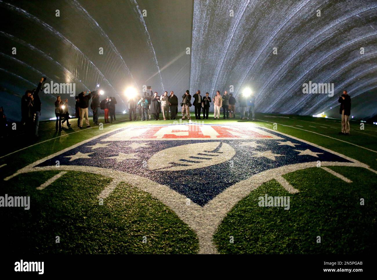 In this photograph taken with a fisheye lens, the NFL logo at midfield ...