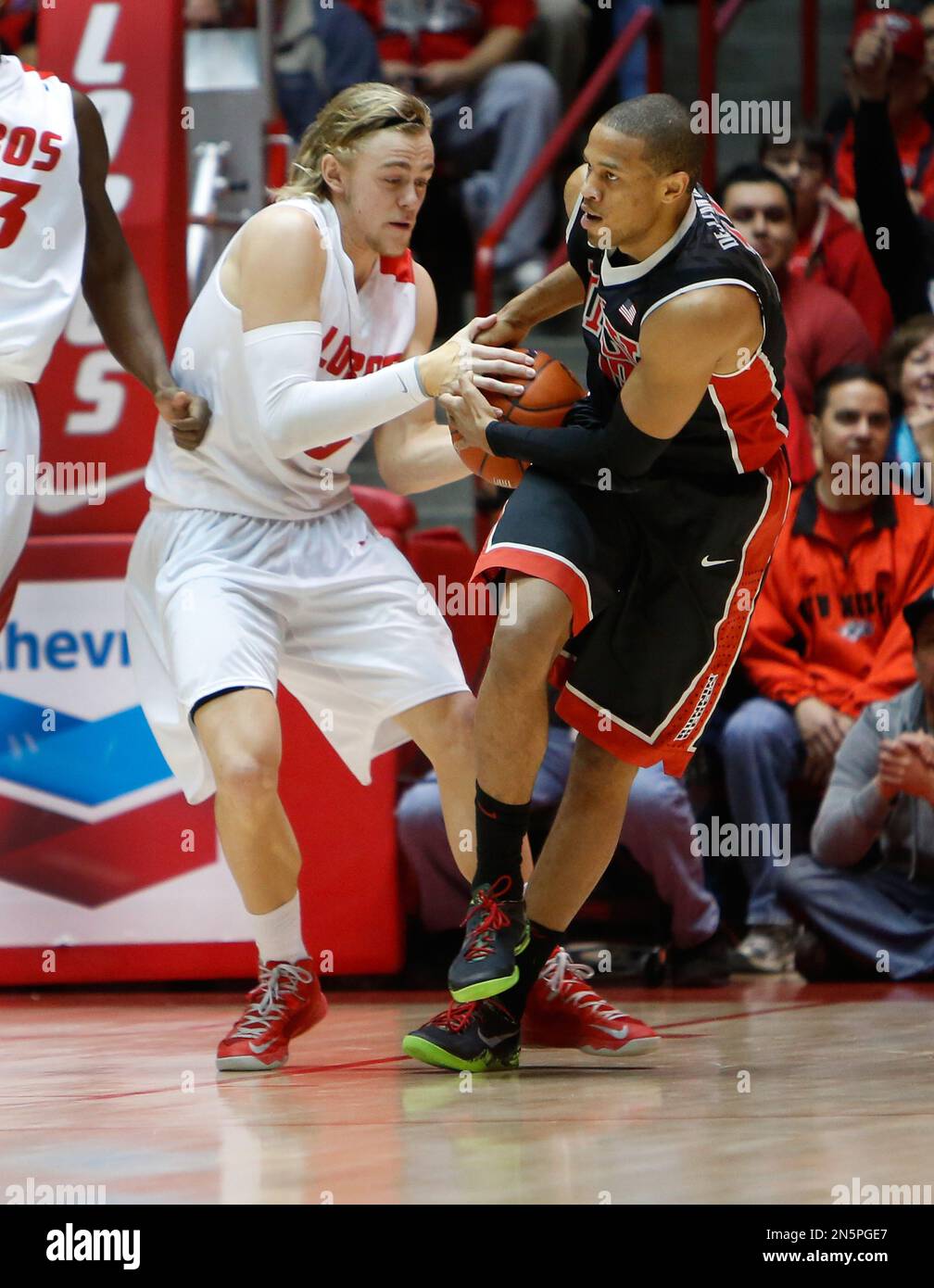 UNLV's Bryce Dejean-Jones, right, and New Mexico's Hugh Greenwood fight ...