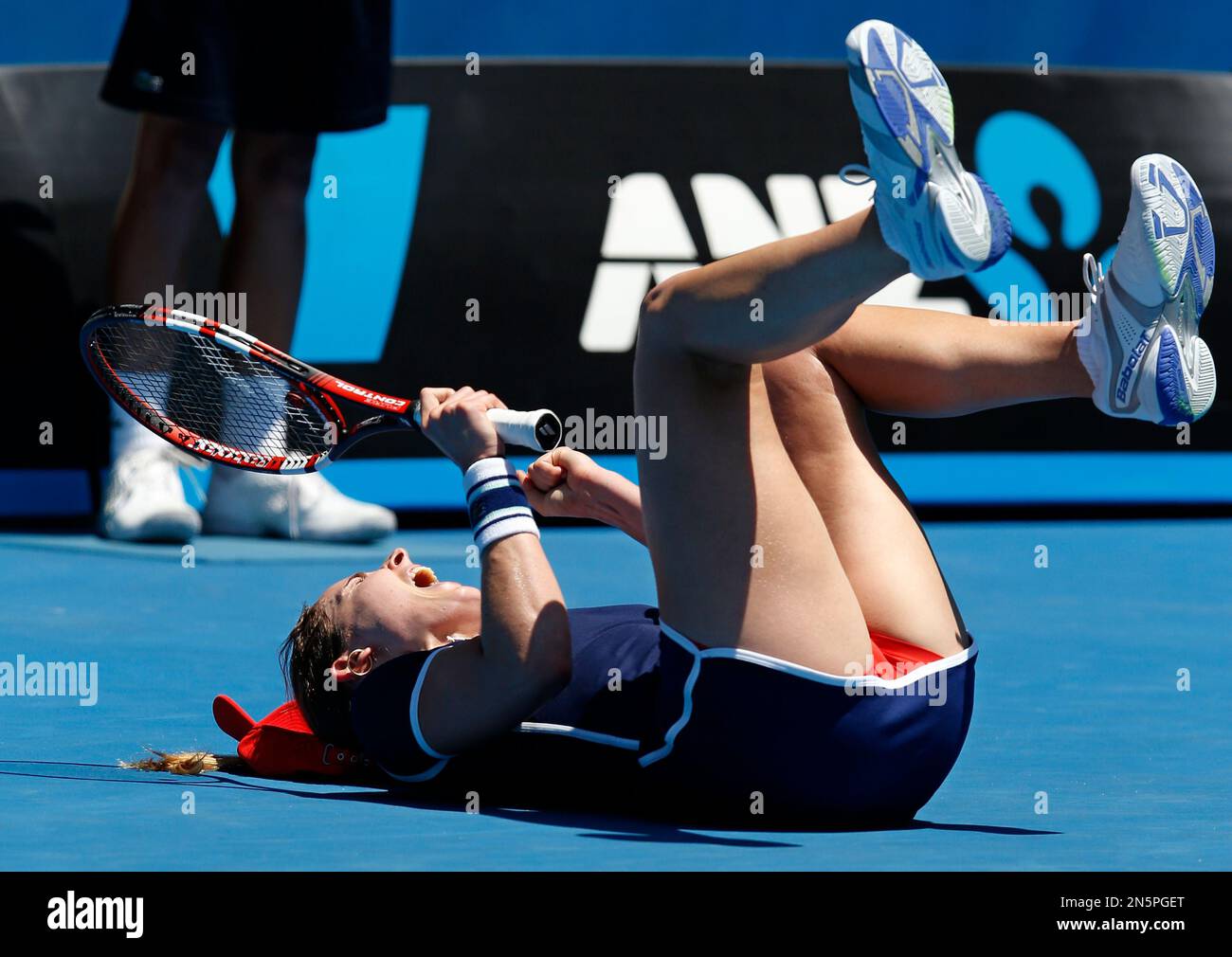 Alize Cornet of France celebrates after winning her second round match ...