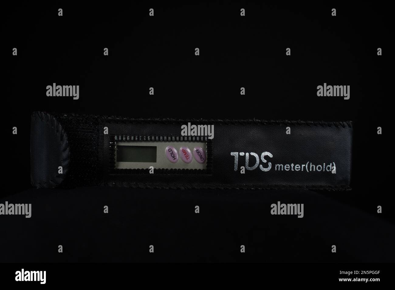 EXETER, DEVON, UK - JANUARY 11, 2023 CE TDS-3 meter(hold) for measuring ...