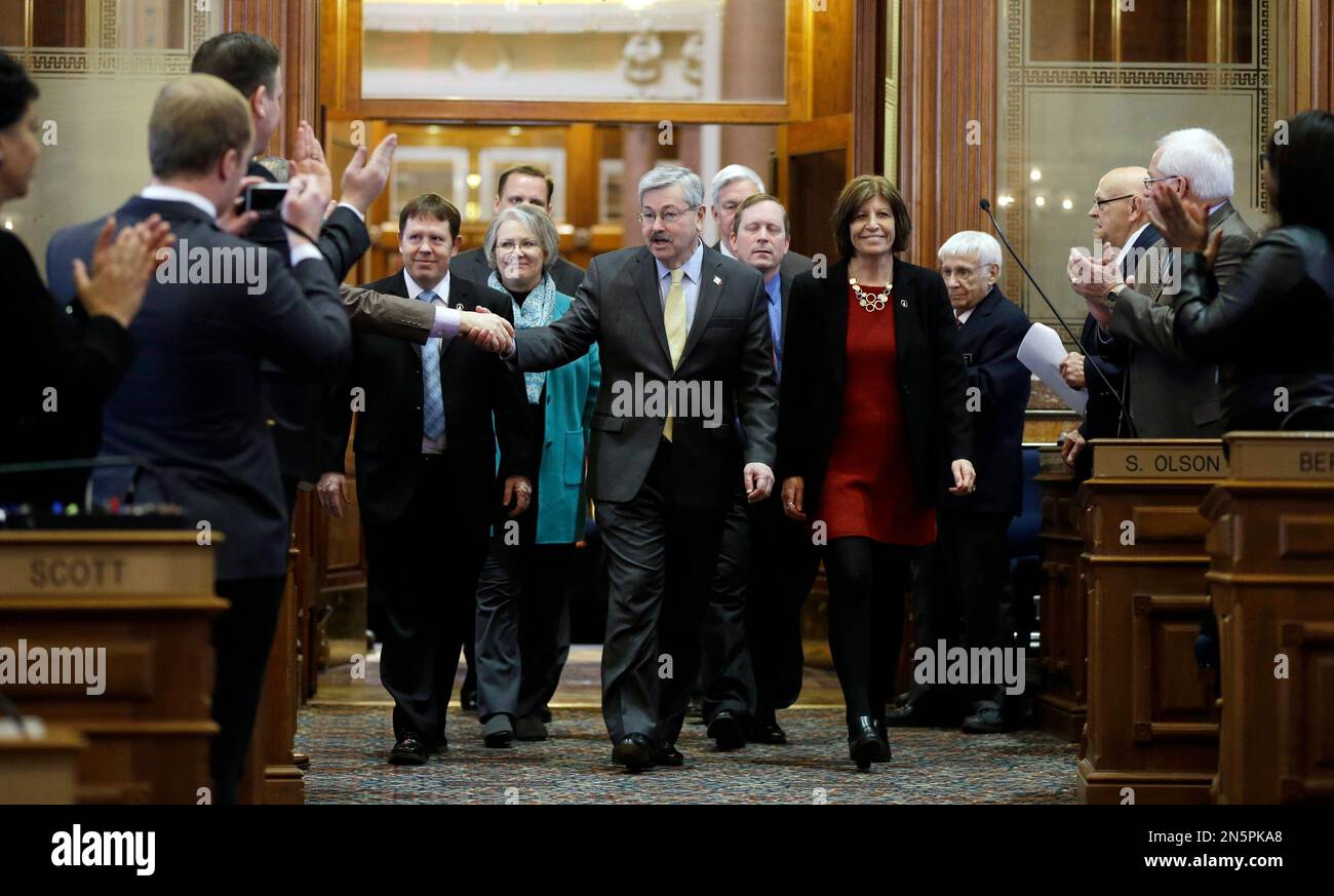Iowa Gov. Terry Branstad, center, is greeted as he enters the Iowa ...