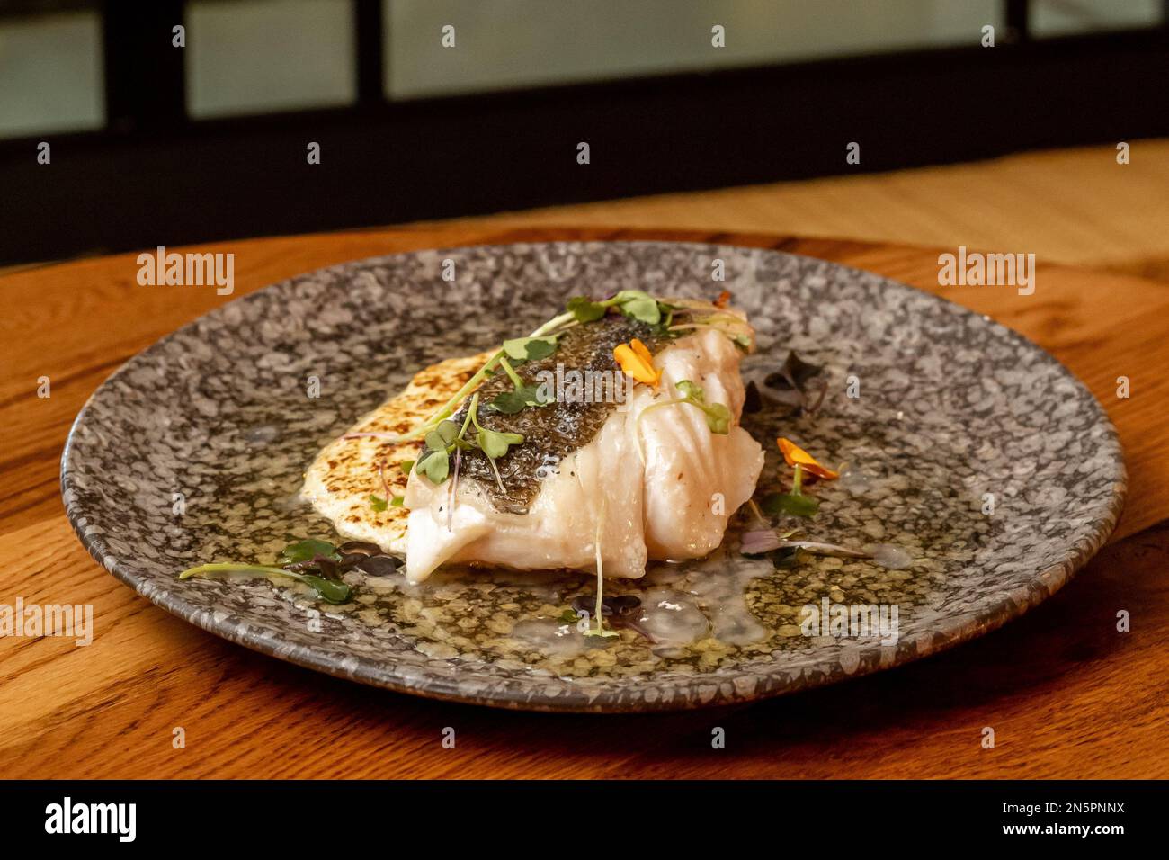A pice of cooked fish meat on the plate Stock Photo - Alamy