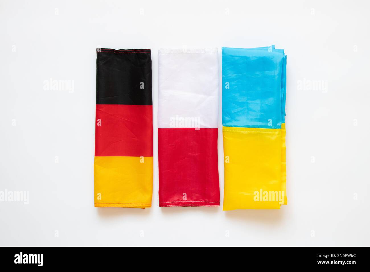 Three flags of Germany and Ukraine and Poland on white as a background ...