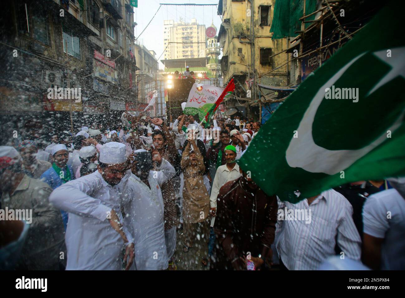 CORRECTING CITY IN CAPTION TO MUMBAI - An Indian Muslim boy waves a ...