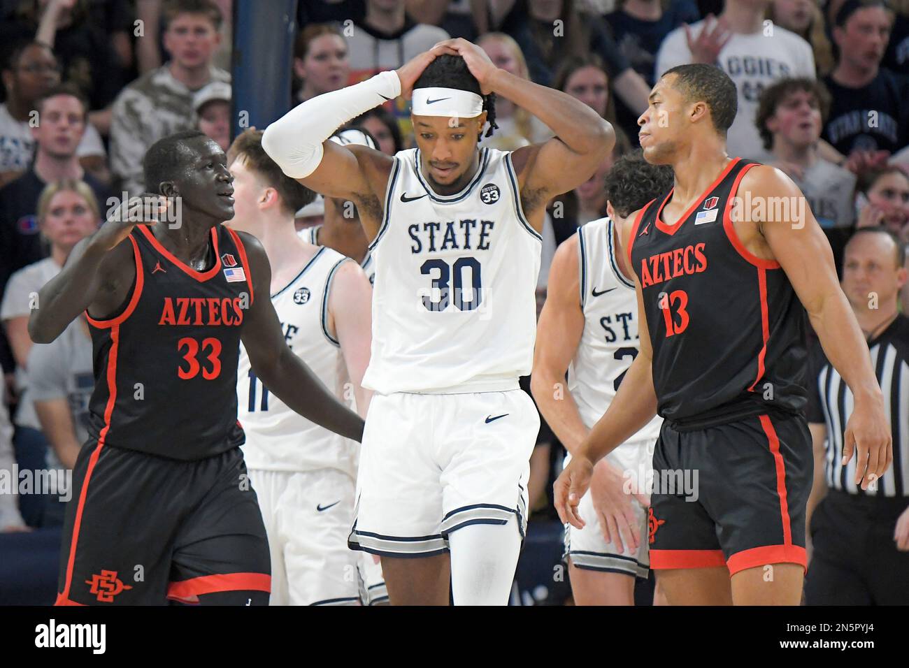 Utah State forward Dan Akin (30) reacts after getting called for a foul ...