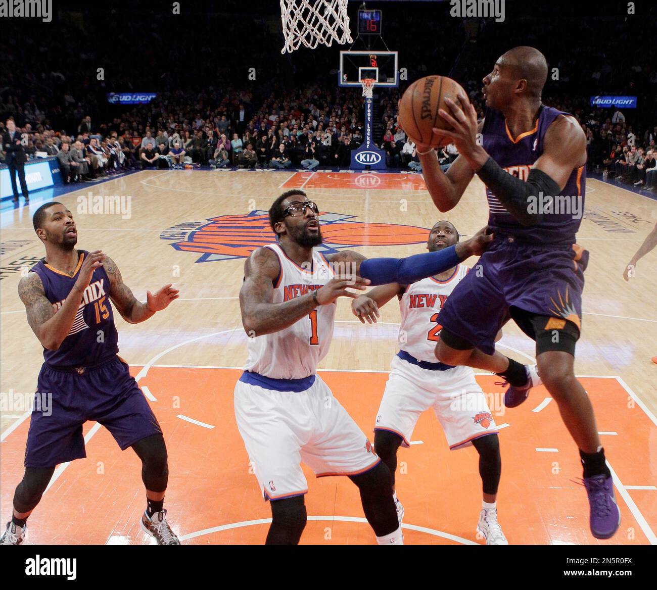 Phoenix Suns' Leandro Barbosa, right, of Brazil, drives past New York ...