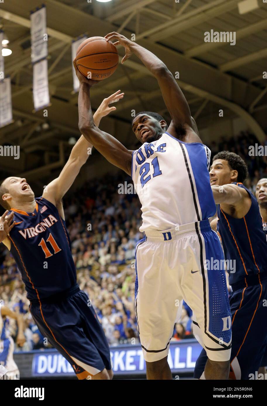 Duke's Amile Jefferson (21) and Virginia's Evan Nolte (11) reach for a ...