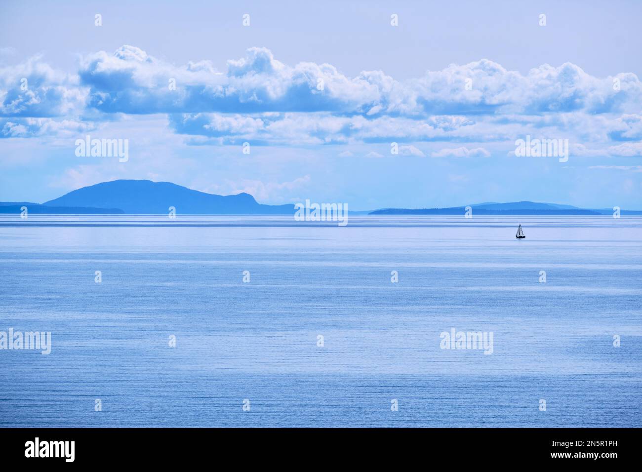 Solitary sail boat in the Salish Sea between White Rock, BC and the ...