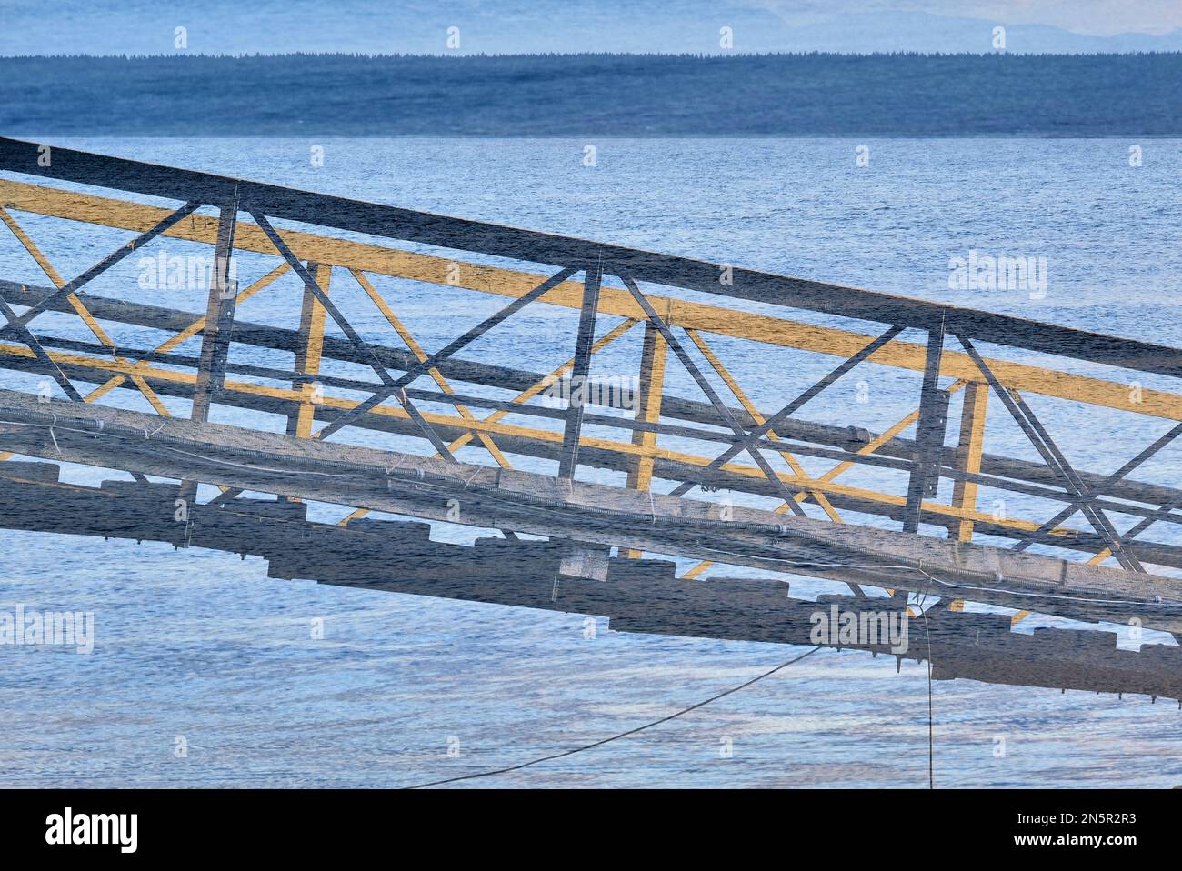 Abstract double exposure of yellow and black foor bridge over ...