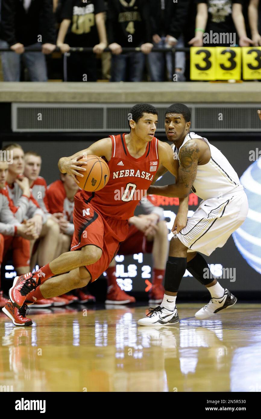 Purdue guard Ronnie Johnson, right, defends Nebraska guard Tai Webster ...