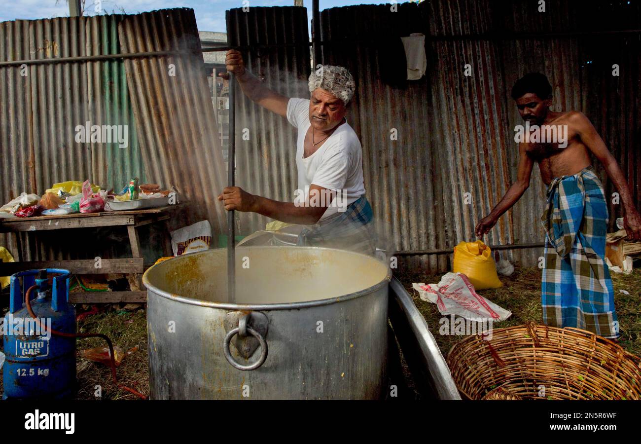 A Sri Lankan Food Vendor Cooks Rice At A Makeshift Hut Outside A Hindu