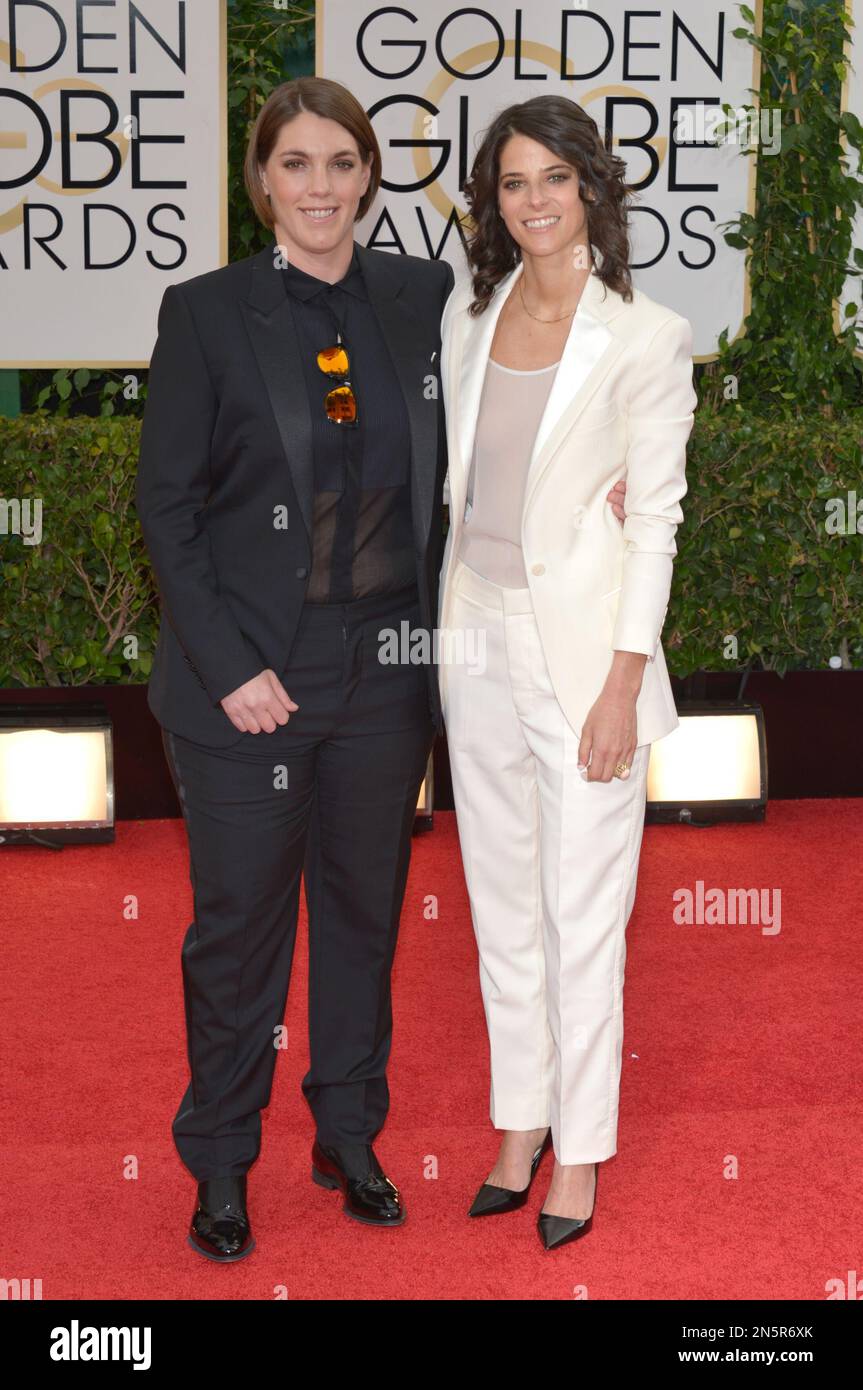 Megan Ellison, left, and Robyn Shapiro arrive at the 71st annual Golden ...