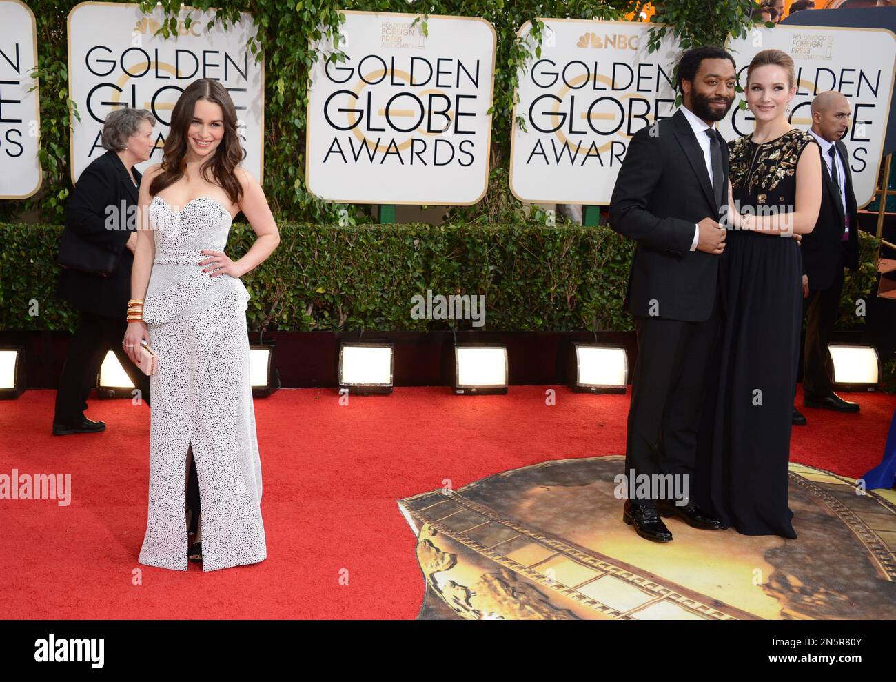 From left, Emilia Clarke, Chiwetel Ejiofor, and Sari Mercer arrive at ...
