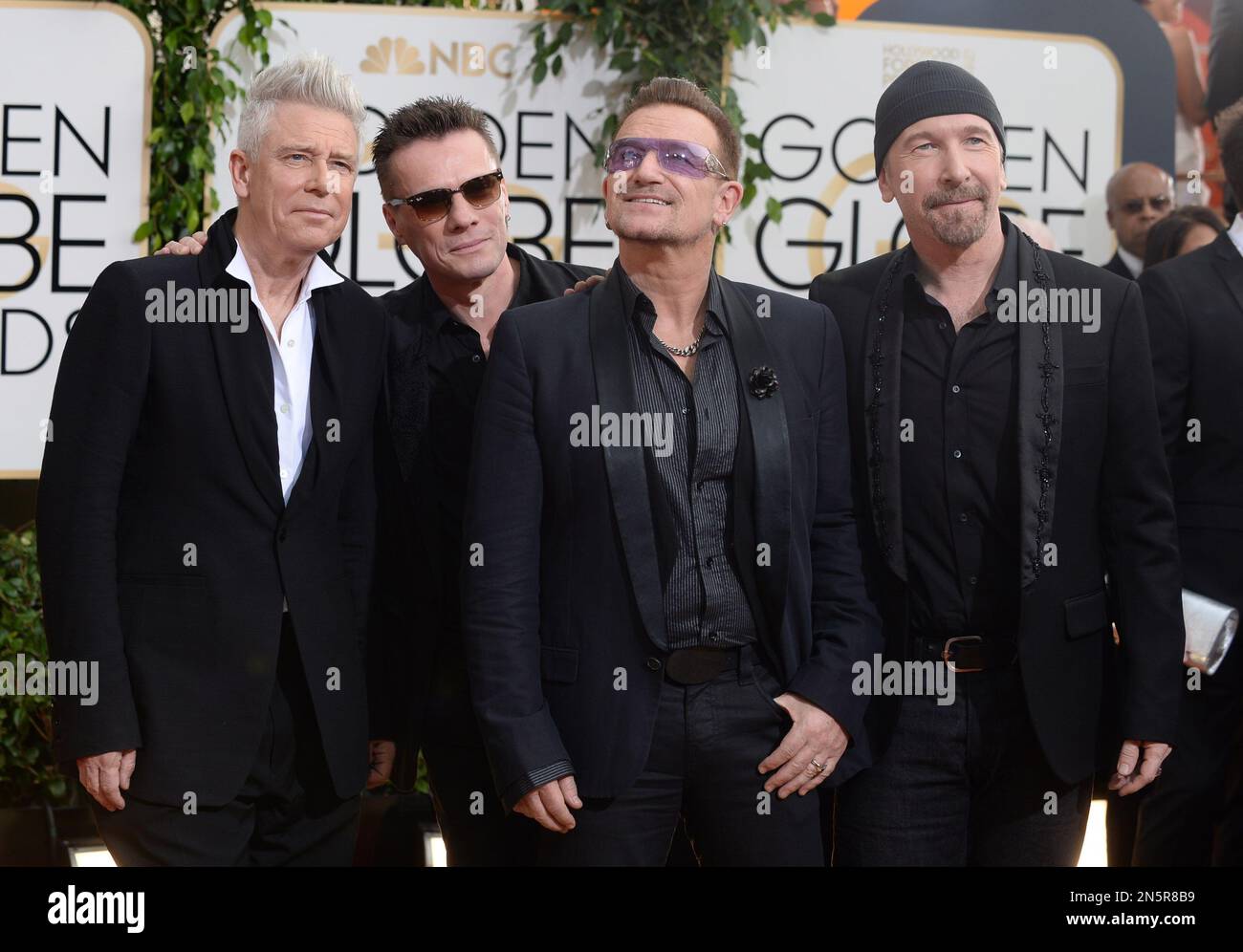 Members of the Irish rock band U2, from left, Adam Clayton, Larry ...