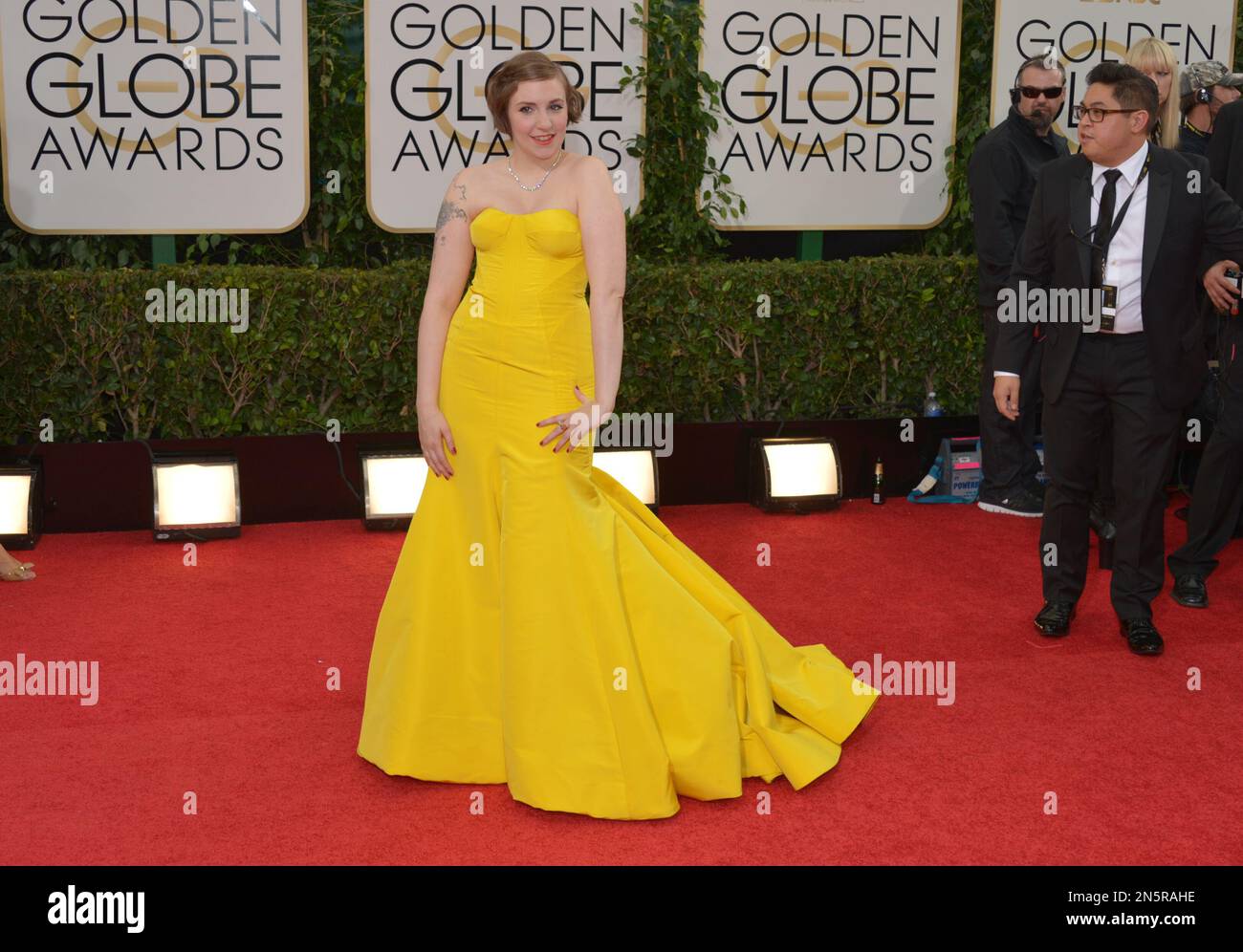 Lena Dunham arrives at the 71st annual Golden Globe Awards at the ...