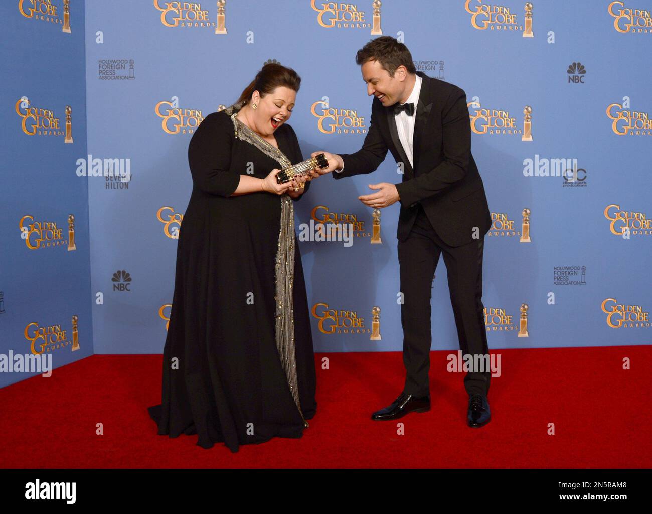 Melissa McCarthy, left, and Jimmy Fallon pose in the press room at the ...