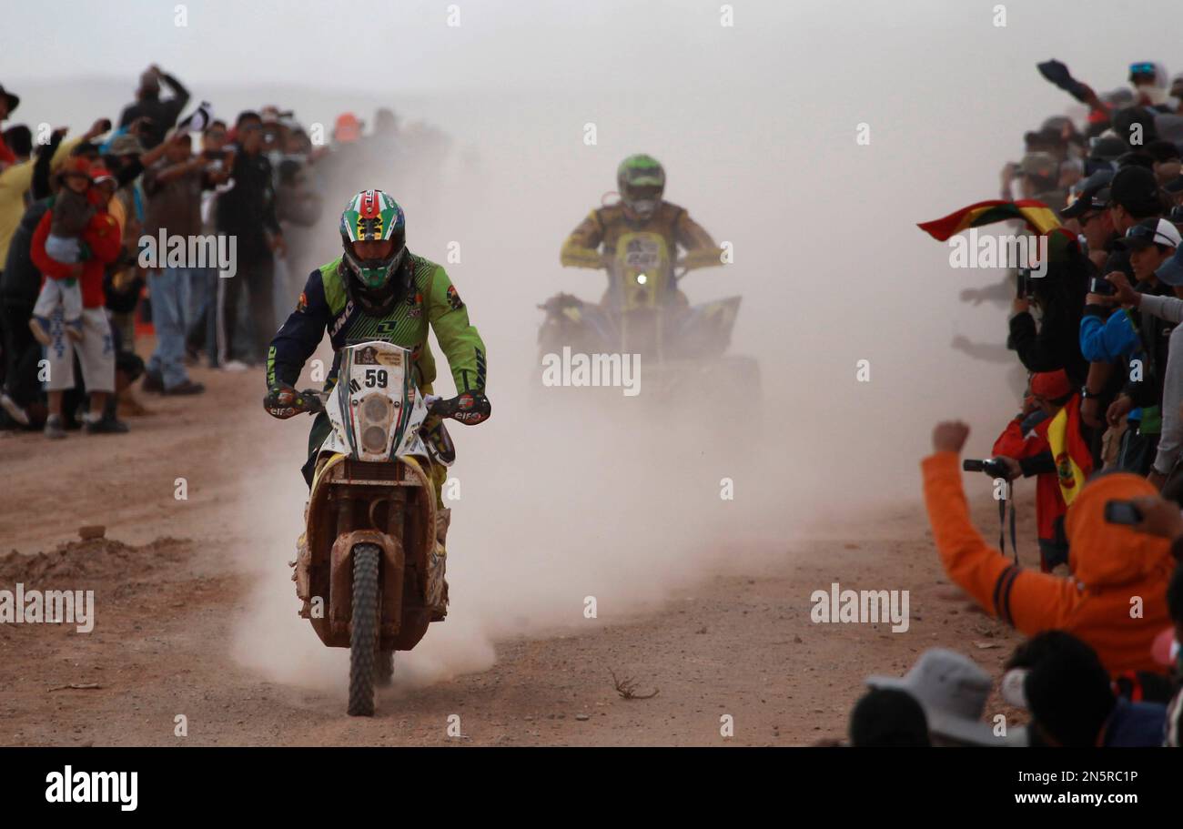 KTM rider Brett Cummings of South Africa, left, and Yamaha rider ...