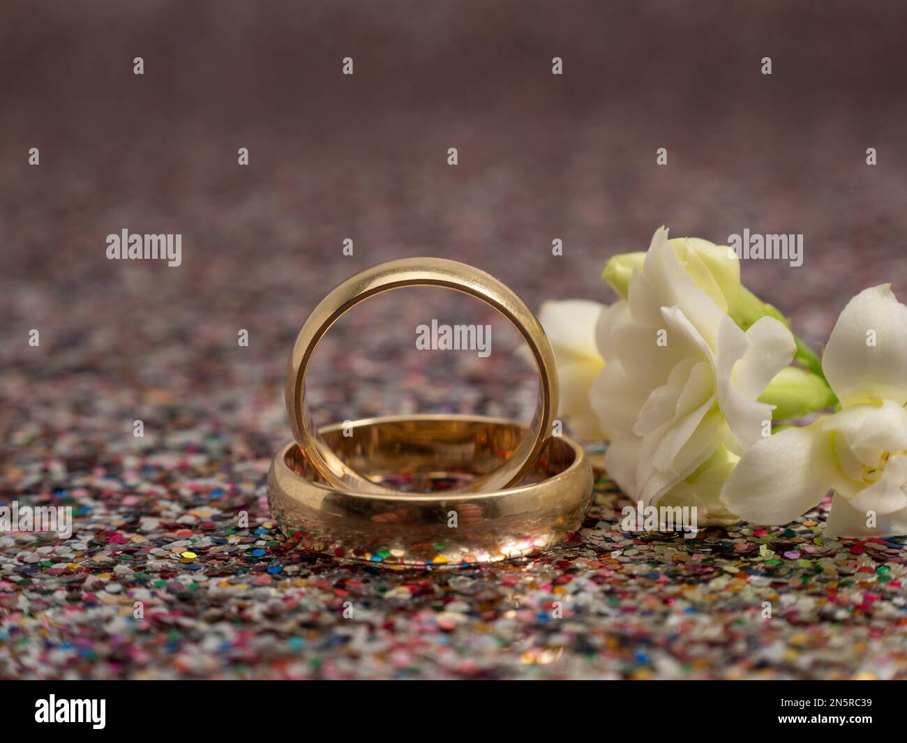 Wedding rings on a shiny background. Gold rings. Close-up Stock Photo ...