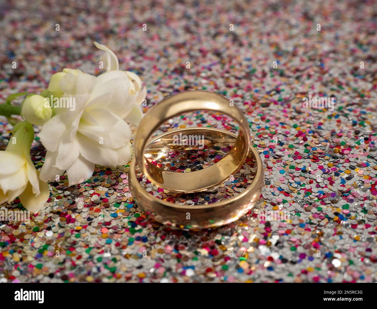 Wedding rings on a shiny background. Gold rings. Close-up Stock Photo ...