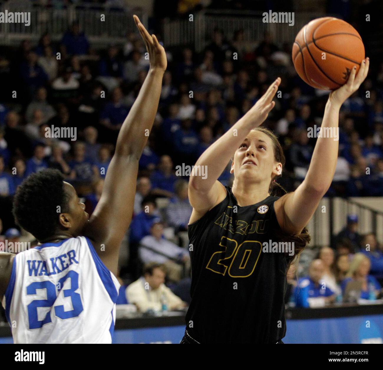 Missouri's Kayla McDowell (20) shoots near Kentucky's Samarie Walker ...