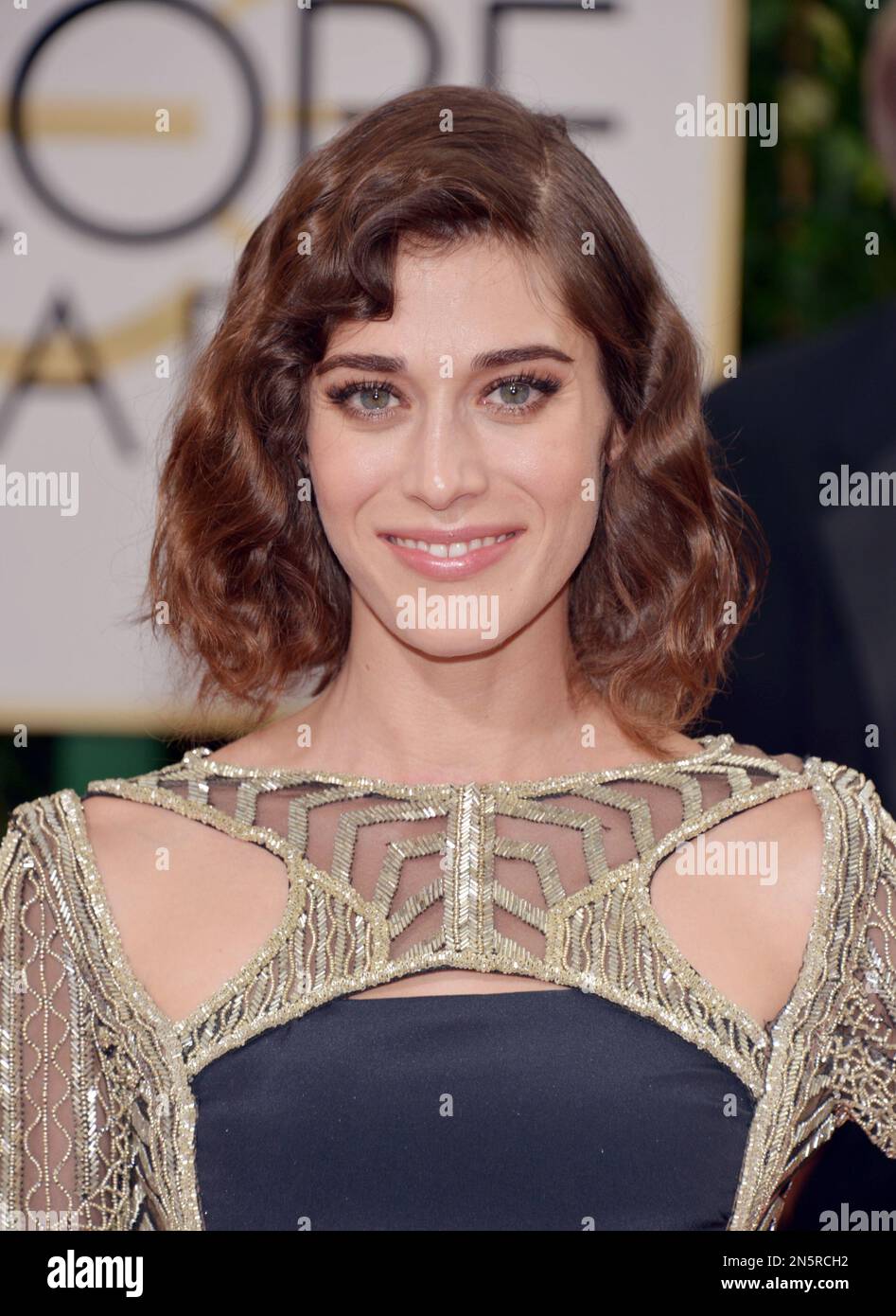 Lizzy Caplan arrives at the 71st annual Golden Globe Awards at the ...