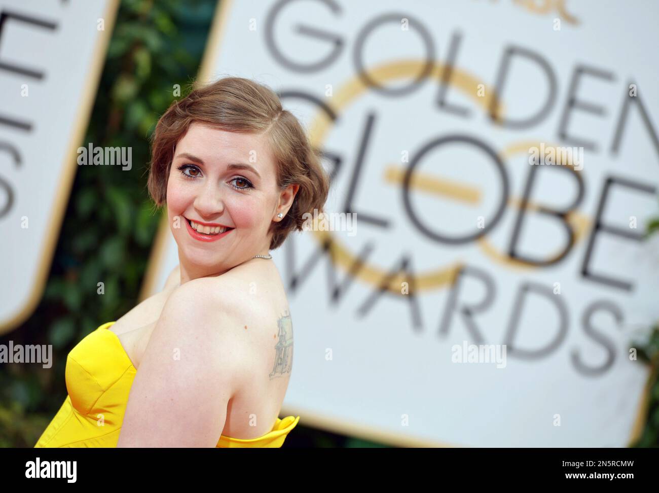 Lena Dunham arrives at the 71st annual Golden Globe Awards at the ...