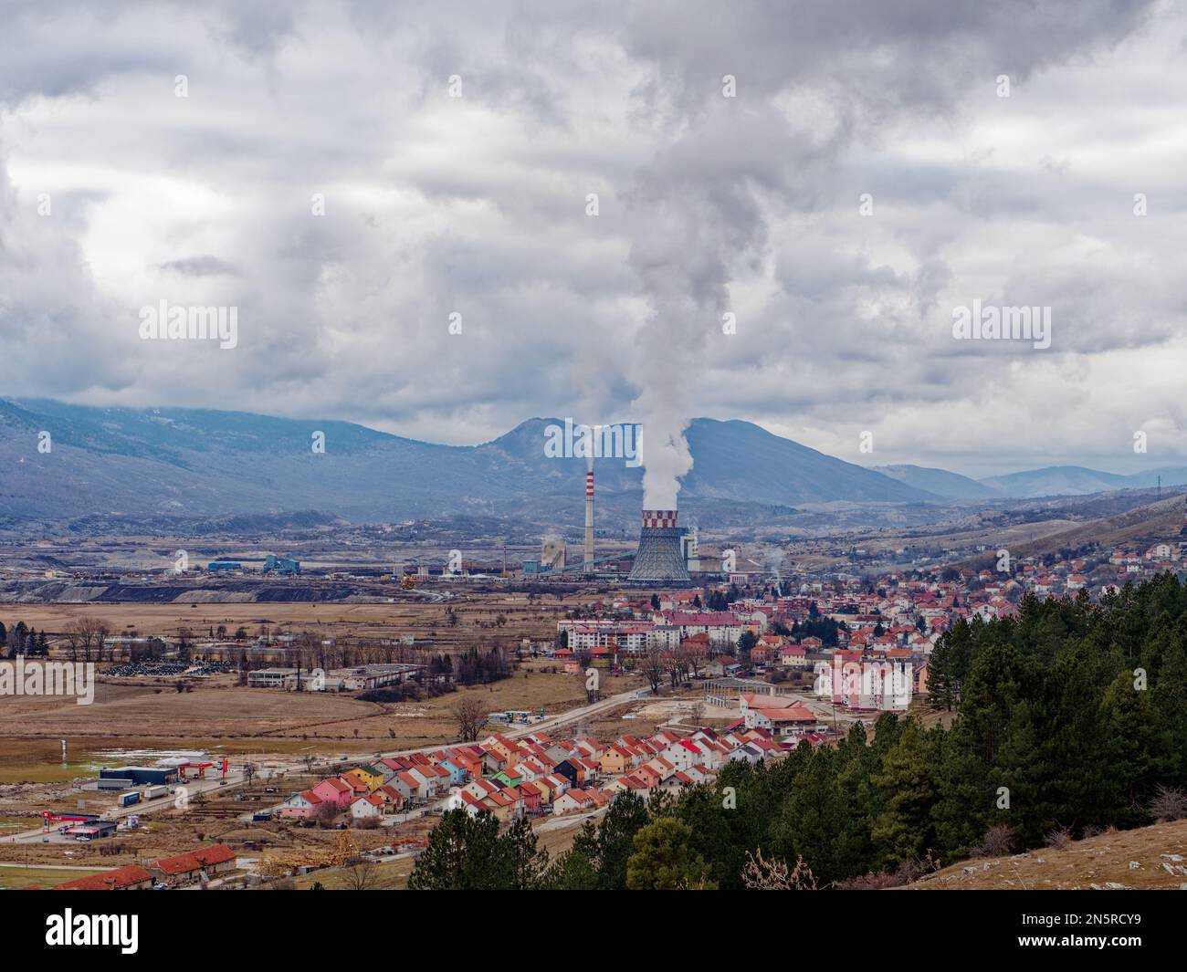 Thermal power station expelling pollutants to the air. City with poor ...