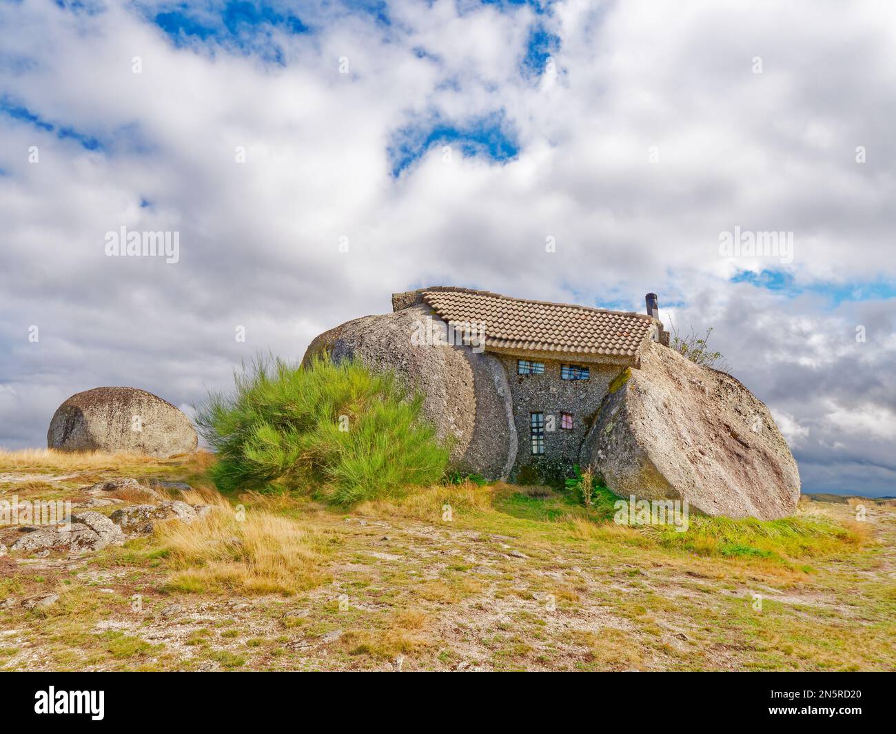 Boulder house or Casa do Penedo, a house built between huge rocks on top of a mountain in Fafe ...