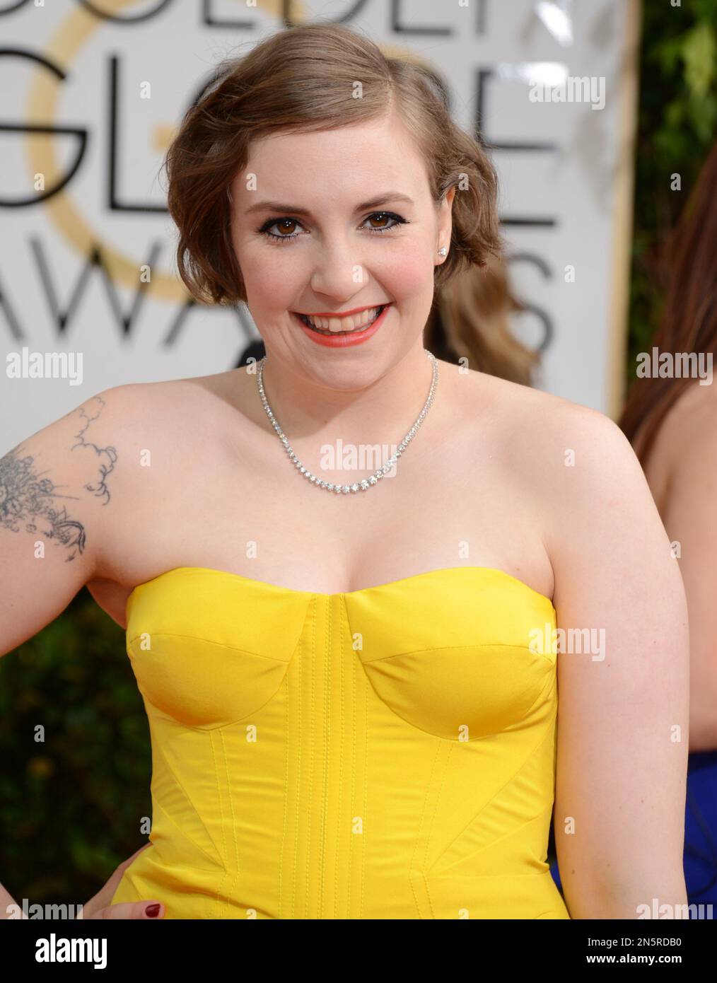 Lena Dunham arrives at the 71st annual Golden Globe Awards at the ...