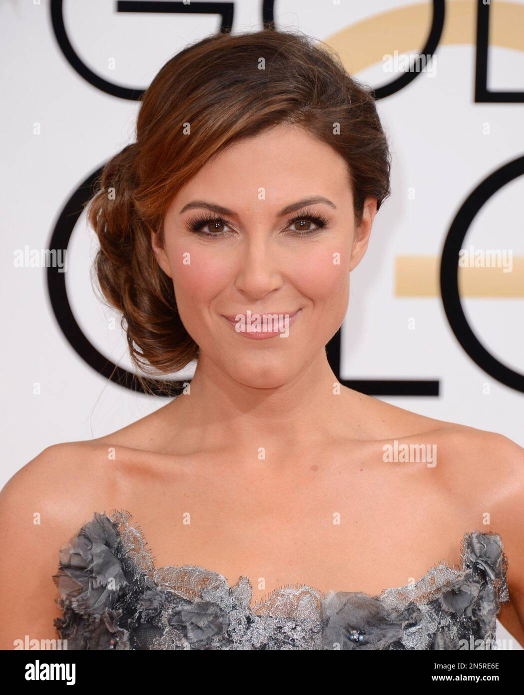Thea Andrews arrives at the 71st annual Golden Globe Awards at the ...